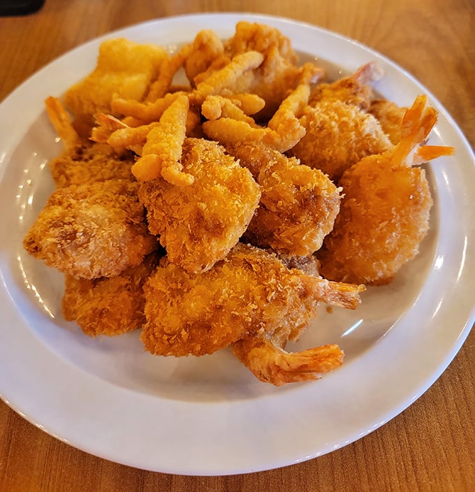 Behold the star attraction! These golden-battered fried shrimp aren't just food—they're little crustacean miracles that have launched a thousand return trips to the buffet line.