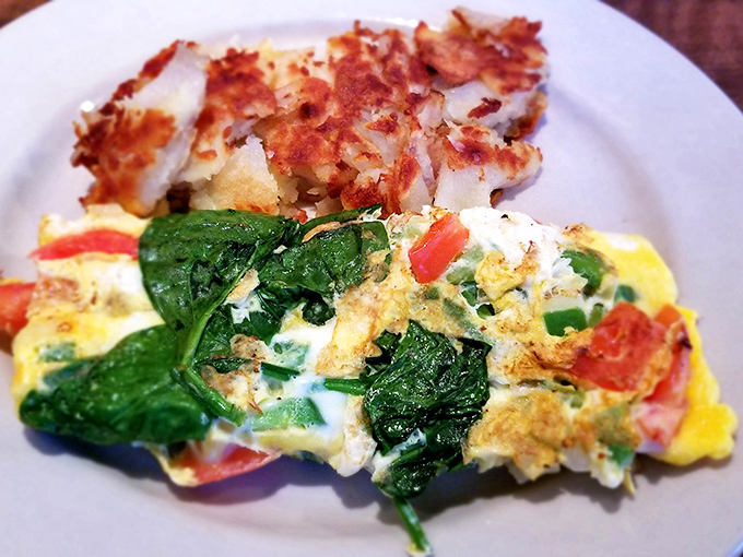 The star of the show – a frittata that's achieved that perfect balance between fluffy and substantial, with spinach and tomatoes playing supporting roles.