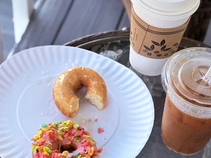A simple glazed donut with a bite missing – the universal symbol for "I couldn't wait to take a picture before tasting this masterpiece."