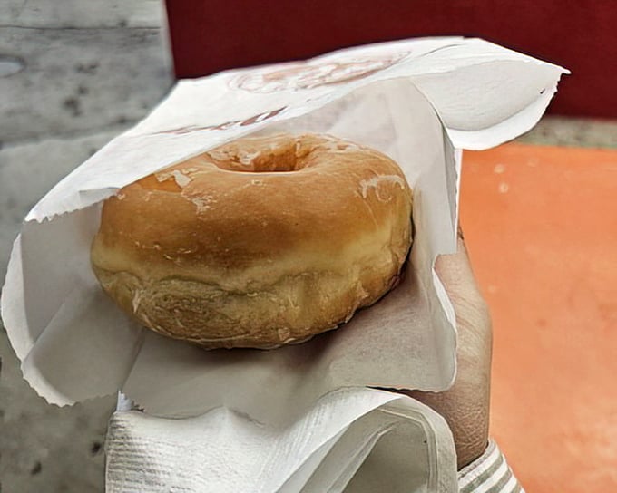 This glazed donut isn't trying to reinvent the wheel—it's just perfecting it. The glassy sheen promises that perfect first bite.