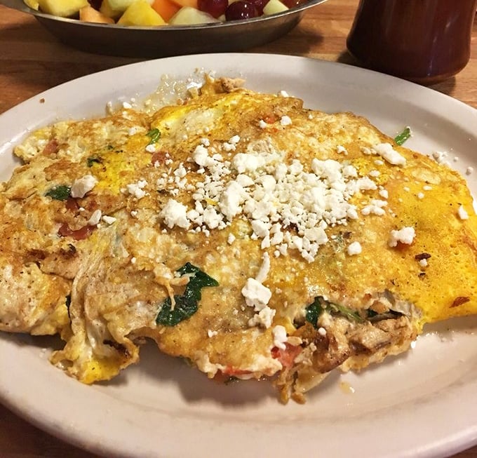 Not all heroes wear capes—some come as golden omelets topped with feta, bursting with fillings that make you question all other breakfast choices.
