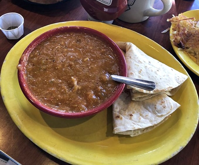This isn't just green chili—it's liquid Colorado sunshine in a bowl. The perfect marriage of heat and flavor that makes tortillas weep with joy.