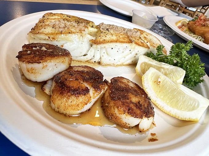 Perfectly seared scallops alongside buttery fish that flakes at the mere suggestion of a fork. This plate isn't trying to impress Instagram—it's trying to impress your taste buds.