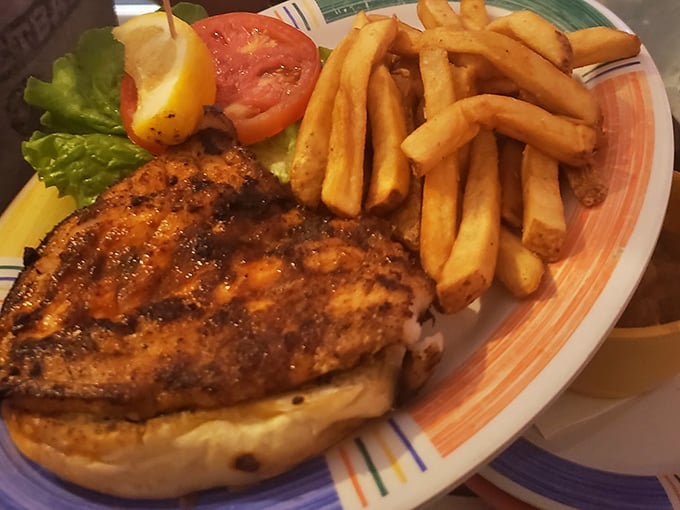 Blackened perfection on a bun. This sandwich isn't trying to impress anyone with height or garnish—it lets that perfectly seasoned fish do all the talking. 