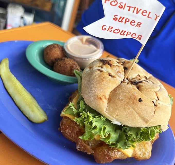 This grouper sandwich looks like it could star in its own fishing show – golden, glorious, and absolutely massive.