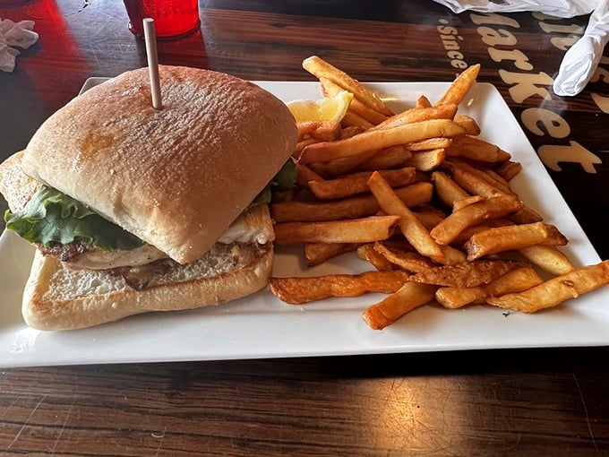 This isn't just a sandwich; it's Florida's edible ambassador. Golden-brown grouper on a pillowy bun with hand-cut fries – vacation on a plate.