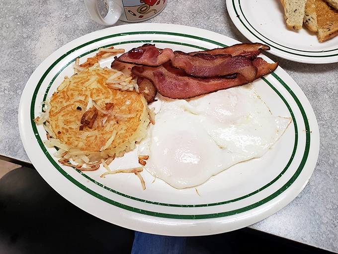 Breakfast of champions! Crispy hash browns that could make a potato weep with pride alongside eggs so perfectly cooked they deserve their own Instagram account.