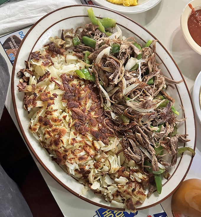 This isn't just breakfast—it's an architectural marvel of shredded beef, crispy hash browns, and green peppers that would make Frank Lloyd Wright jealous.