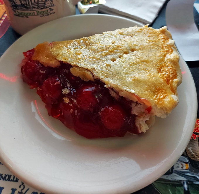 This cherry pie isn't just dessert—it's edible artwork with a perfect golden crust and ruby filling that would make Agent Cooper weep with joy.