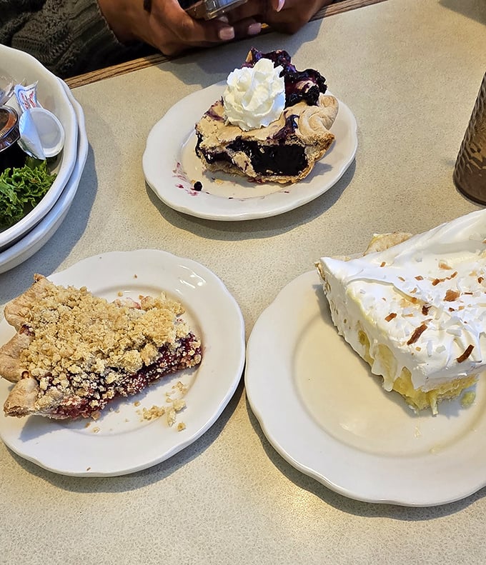 Three slices of heaven, each one a masterpiece – the blueberry pie alone could solve most of life's problems.