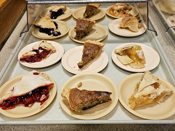Pie paradise found! This tray of homemade slices isn't just dessert—it's an edible museum of American baking tradition, with each variety vying for your fork's attention.
