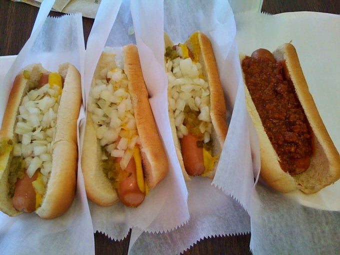 The lineup that launched a thousand cravings: classic dogs with chopped onions alongside the legendary chili dog—simplicity at its most delicious.