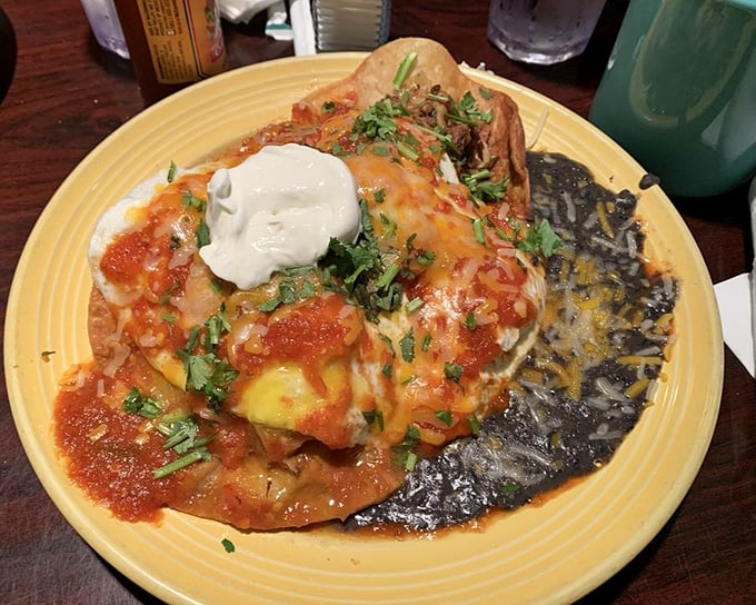Behold the star of the show: Huevos Rancheros that could make a rooster crow with delight. That dollop of sour cream is the perfect cool counterpoint to the spicy sauce.