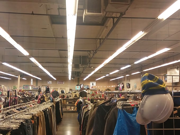 Inside, fluorescent lights illuminate racks upon racks of clothing treasures waiting to be discovered by patient explorers.