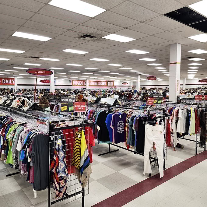 Racks stretch endlessly like a fashion rainbow, organized better than most people's closets at home.