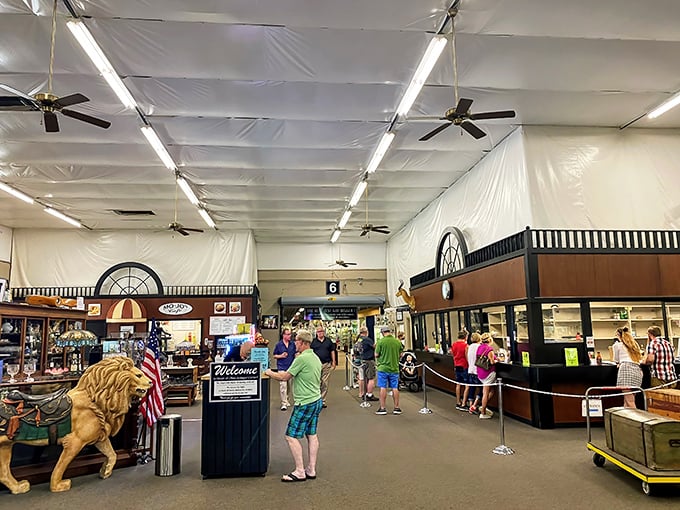 The front desk welcomes visitors with a life-sized lion statue—because nothing says "antiquing" quite like being greeted by the king of the jungle.