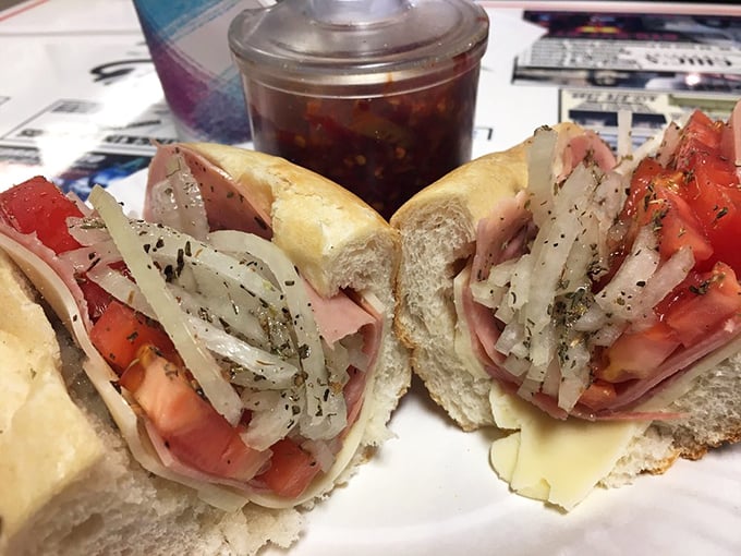 The Italian hoagie in all its glory—layers of capicola, Genoa salami, and provolone creating what can only be described as a masterpiece of sandwich architecture.