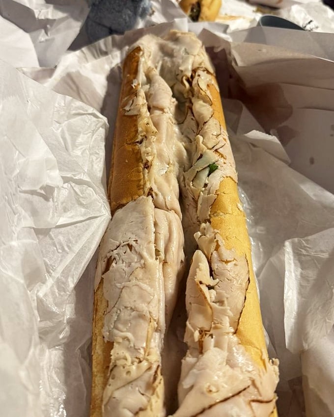 The star of the show in all its glory. Thinly sliced turkey piled high on that perfect roll—a sandwich that demands to be remembered.