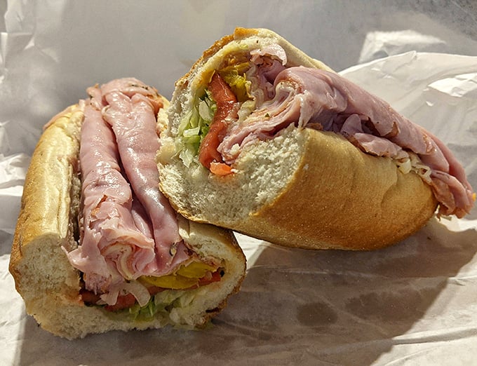 Behold the Italian hoagie in its natural habitat—layers of thinly sliced meats and fresh veggies nestled in a perfect roll. Poetry in sandwich form.