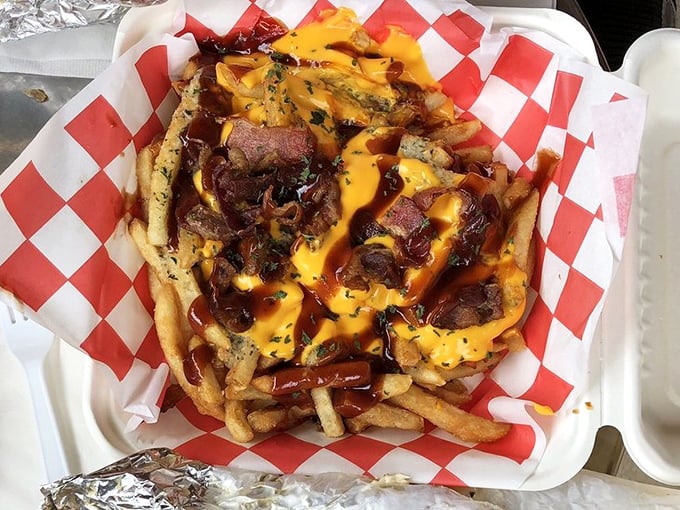 These Jersey Fries aren't just loaded – they're having an existential crisis under that avalanche of cheese, bacon, and sauce. Worth every napkin.