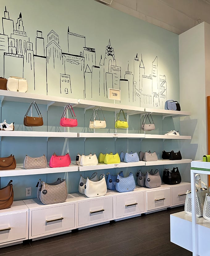 A wall of designer handbags at Kate Spade creates a cityscape of fashion possibilities, each purse a small apartment for your essentials at landlord-friendly prices.
