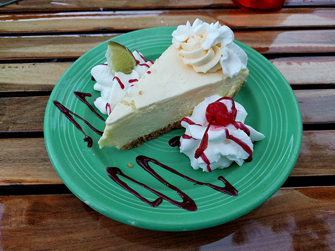 The holy grail of Florida desserts—pale yellow perfection with a graham cracker foundation that would make architects jealous. Key lime pie as nature intended. 