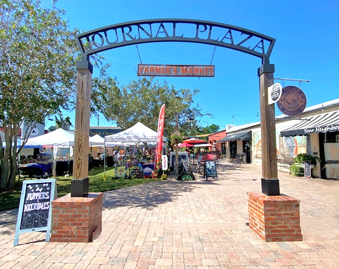 Journal Plaza's farmer's market entrance stands as a gateway to affordable produce and neighborly gossip – both equally fresh.