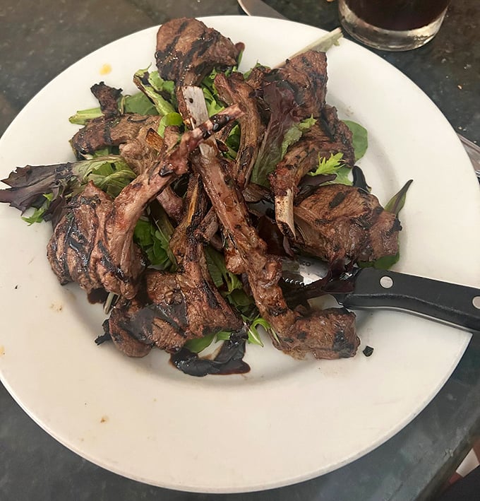 Behold Pennsylvania's finest lamb chops – perfectly grilled, beautifully presented, and absolutely life-changing on every level.