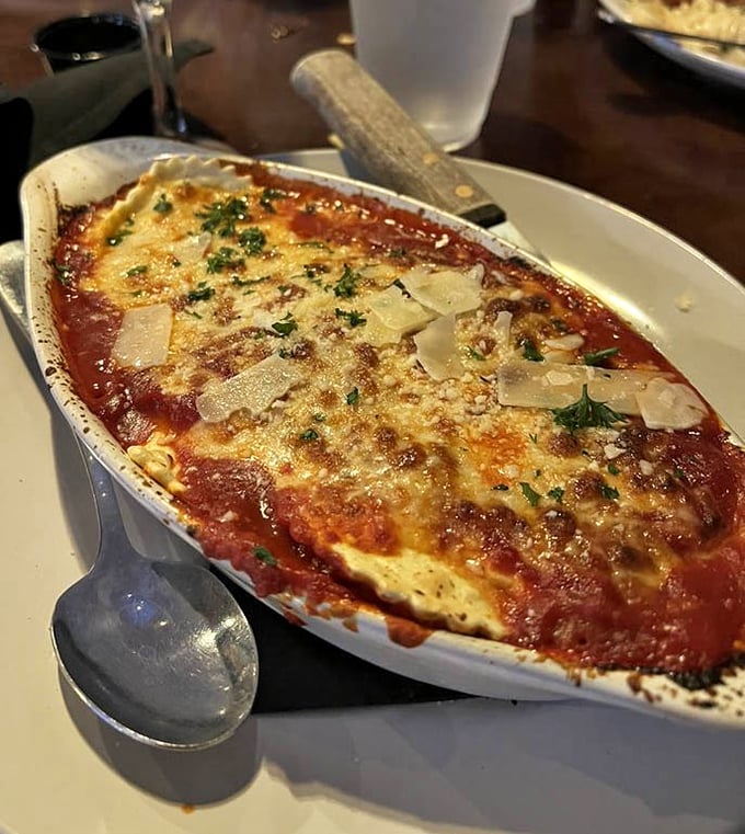 Behold the lasagna that launched a thousand food pilgrimages. That golden, bubbling cheese layer isn't just a topping—it's a promise of the happiness waiting beneath.