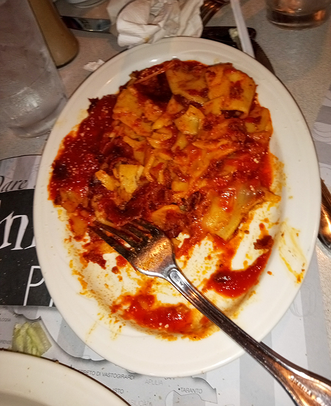 Behold the lasagna that launched a thousand food comas! Those layers aren't just pasta and sauce—they're edible archaeology, each stratum telling a delicious story.