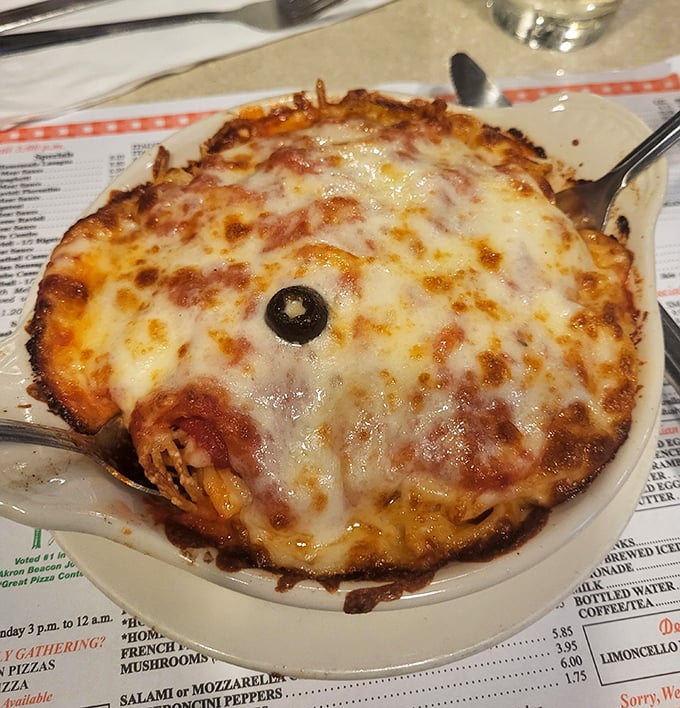 This isn't just lasagna—it's an archaeological dig of flavor, each layer revealing new depths of cheese, sauce, and seasoning that make you want to frame your fork.