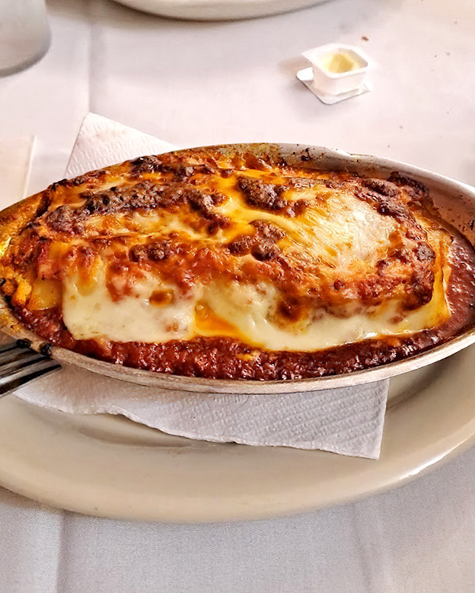 Lasagna that makes time stand still—layers of pasta, cheese, and that legendary sauce creating a bubbling masterpiece worth driving across state lines for.