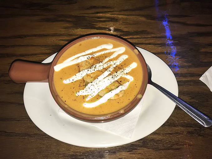 Behold the legendary lobster bisque in all its glory! Those artful cream swirls aren't just decoration—they're the culinary equivalent of a standing ovation.