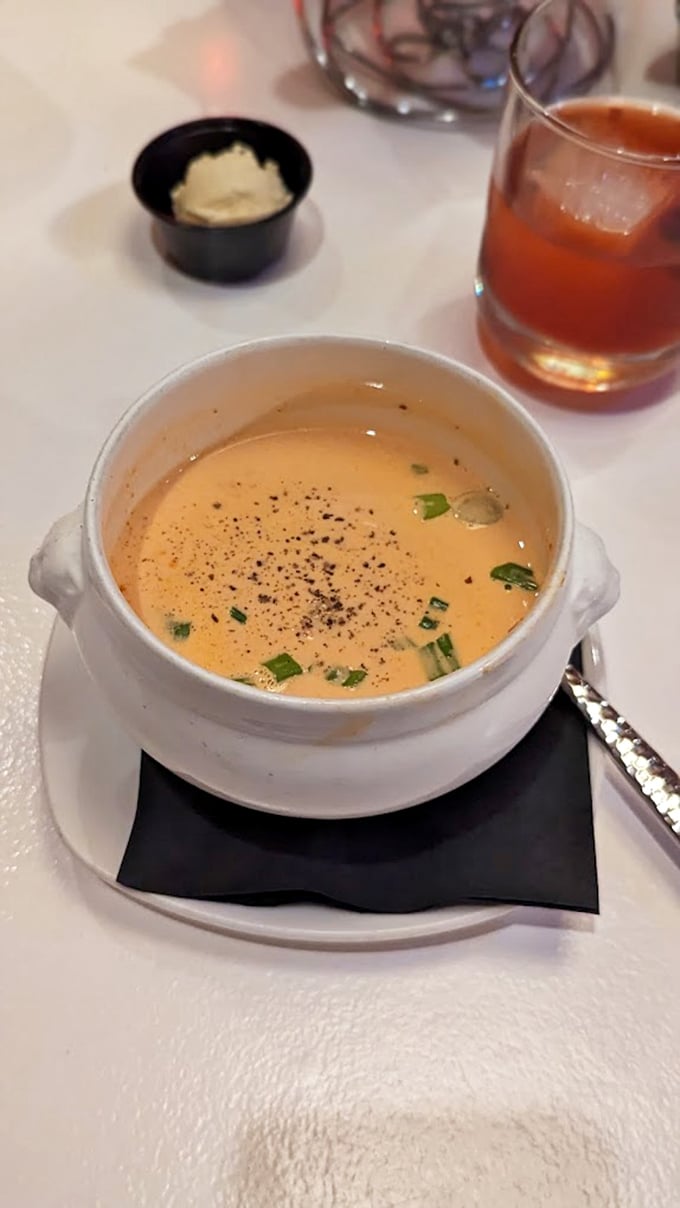 This bisque arrives looking innocent, but one spoonful reveals its deliciously criminal intentions – smooth as Sinatra, rich as Rockefeller.