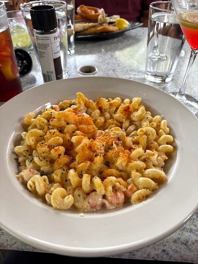 This isn't just mac and cheese—it's a creamy masterpiece studded with sweet lobster chunks that would make even a French chef nod in respect.