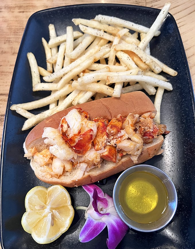 This lobster roll isn't messing around – more meat than a butcher shop, prettier than a sunset.