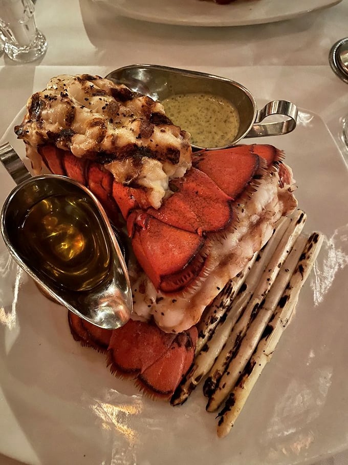 This lobster tail isn't just food—it's a spectacle of the sea. Perfectly split, grilled to sweet tenderness, and served with drawn butter that glistens like liquid gold.