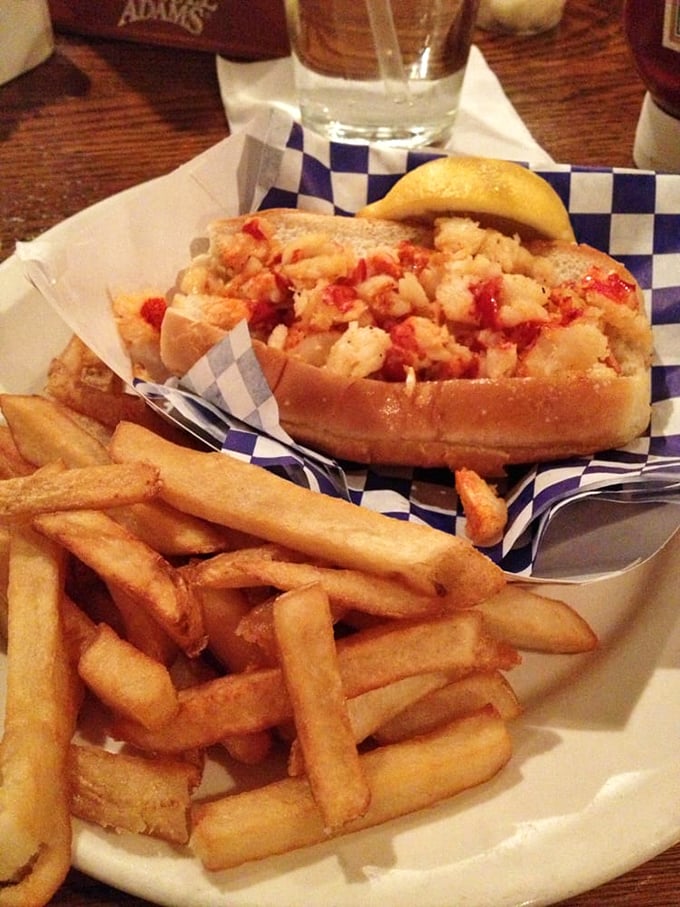 The lobster roll arrives like a summer blockbuster – overflowing with chunky lobster meat and zero special effects needed. Just pure, unadulterated seafood bliss.