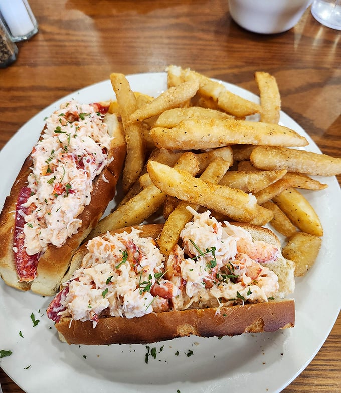 The star attraction: chunks of sweet lobster meat nestled in buttery split-top rolls, served with hand-cut fries that deserve their own fan club.