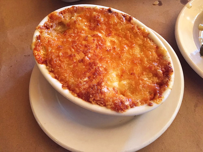 This isn't your childhood mac and cheese—it's a bubbling cauldron of creamy, crusty perfection that's earned its own fan club.