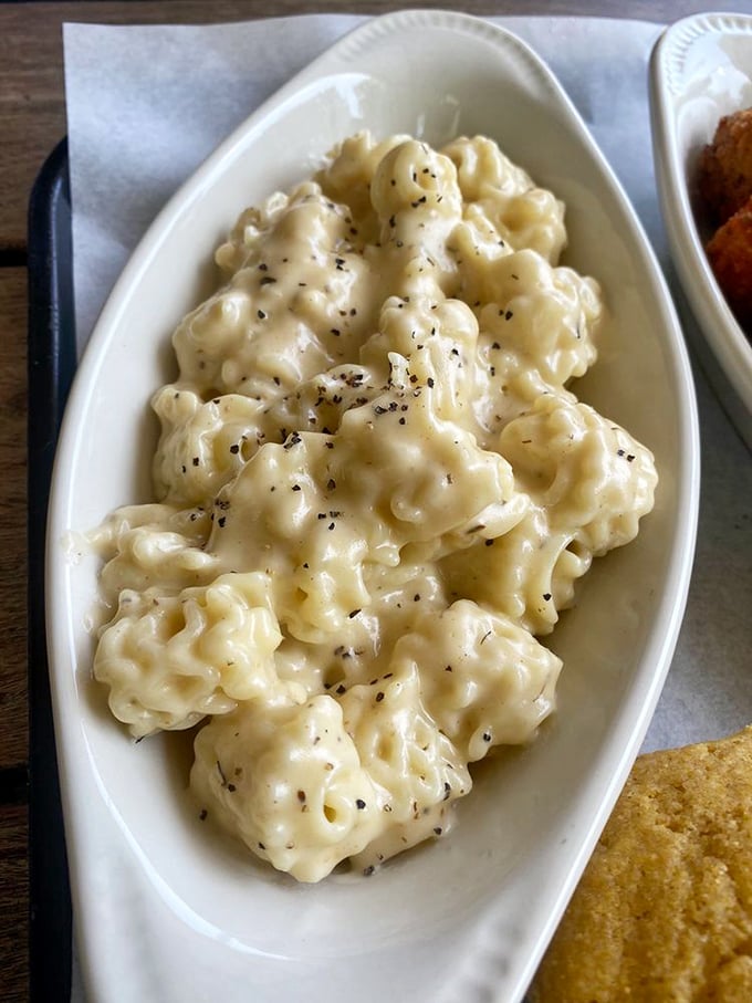 Behold, the mac and cheese that launches a thousand return visits—creamy, dreamy, and somehow both comforting and exciting at once.