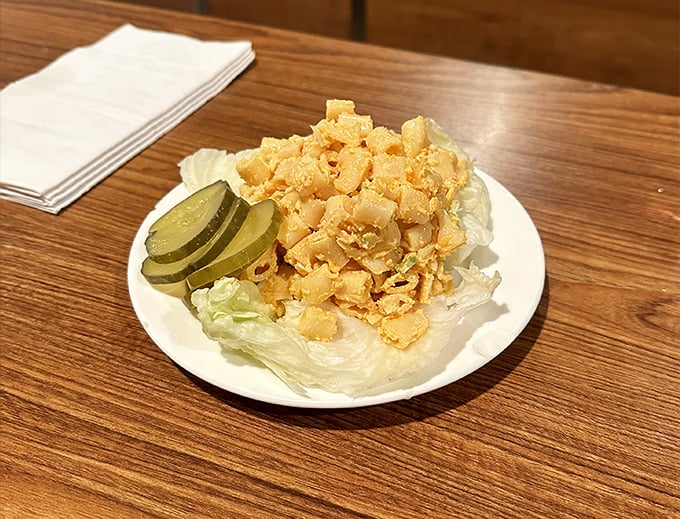 Crispy, golden macaroni salad with pickle slices—proof that sometimes the simplest side dishes create the most powerful nostalgia.
