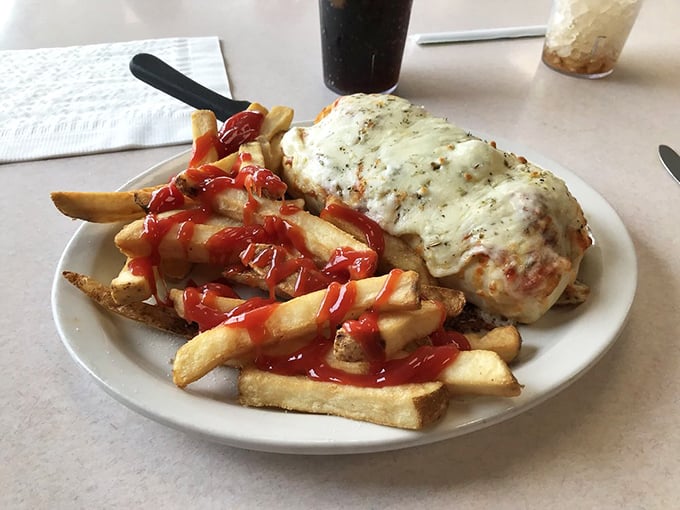 Cheese that stretches to tomorrow! This meatball masterpiece with its golden fries isn't just lunch—it's a commitment to afternoon happiness.