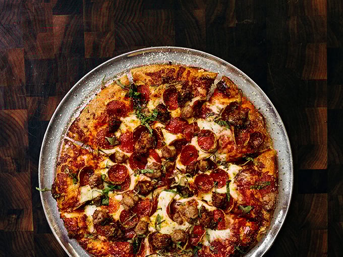 This isn't just a meat lover's pizza; it's a carnivore's dream that somehow manages to be sophisticated rather than excessive.