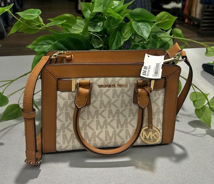 Designer dreams don't have to break the bank. This Michael Kors satchel waits patiently for someone to give it a second life of stylish adventures.