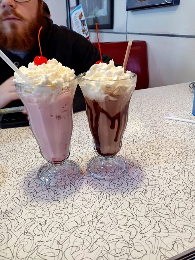 These aren't just milkshakes—they're architectural masterpieces with whipped cream skyscrapers and cherry penthouses. Worth every brain-freeze moment.