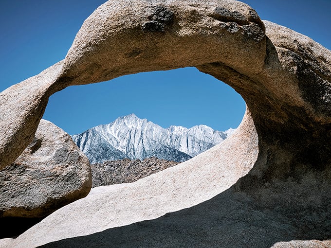 Nature's perfect picture frame. Mobius Arch cradles Mount Whitney like it's showing off its favorite child to visitors.
