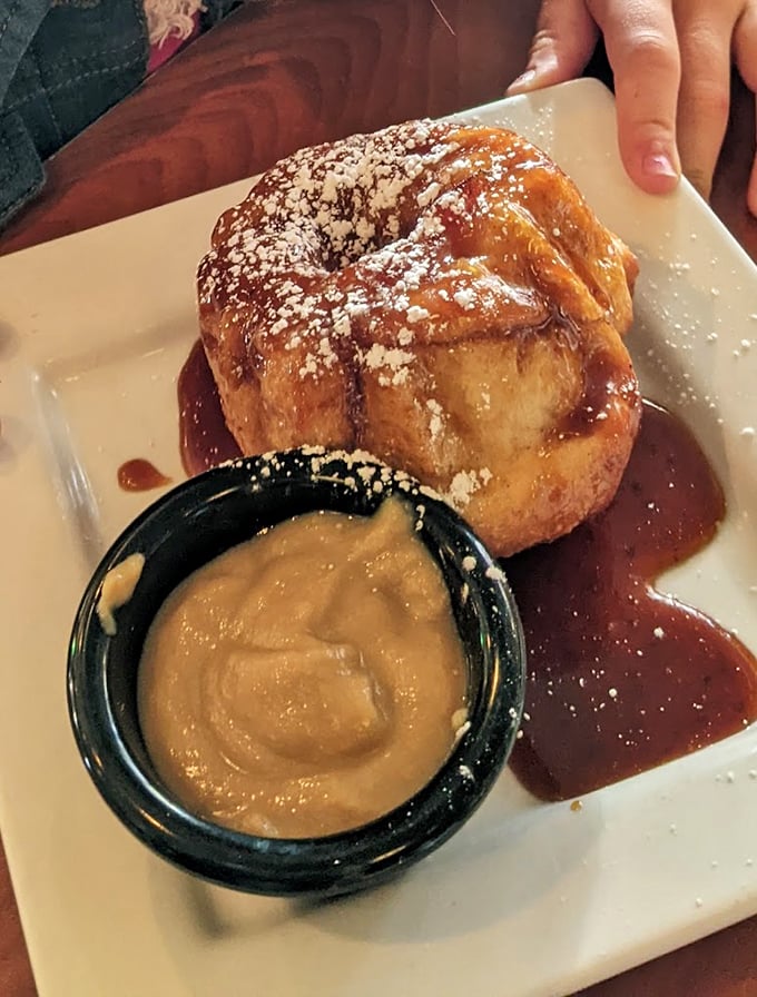 Behold the legendary monkey bread in all its glory! That vanilla cream side isn't optional—it's the perfect cool companion to this warm cinnamon masterpiece.