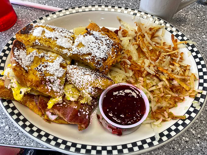 The legendary Monte Cristo in its powdered sugar glory. That little cup of raspberry jam isn't optional—it's the co-star in this sweet-savory romance.