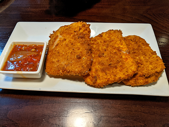 The legendary mozzarella squares in all their golden glory. Crispy armor protecting molten cheese treasure—worth every mile of Pennsylvania highway you traveled to get here.